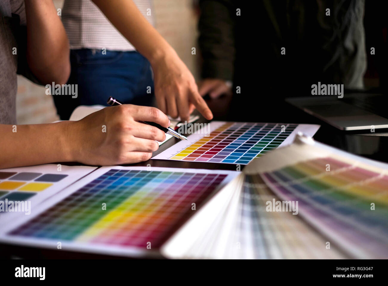 Graphic designers choose colors from the color bands samples for design ...
