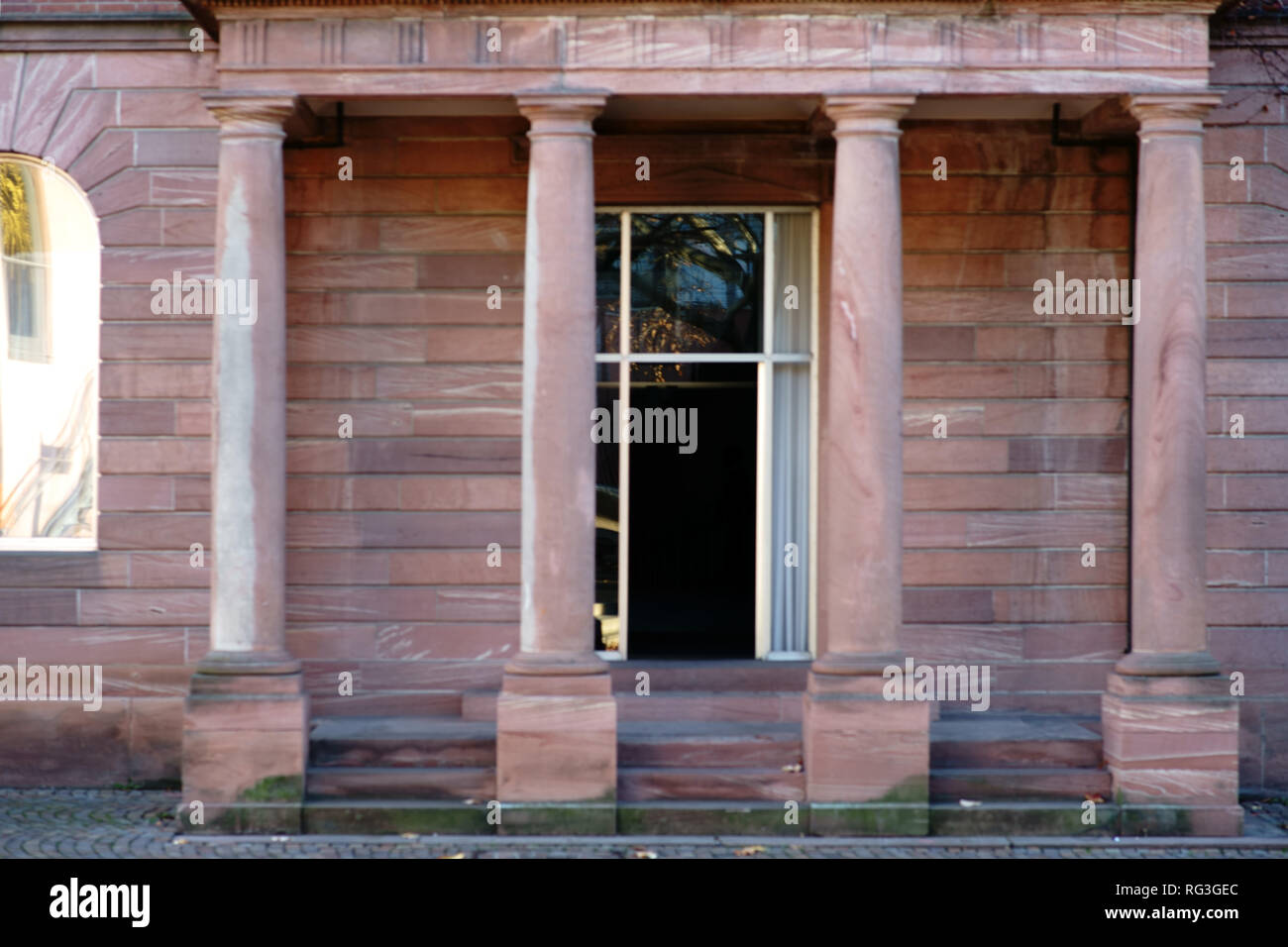 The entrance of a newly built and modern museum with columns in front ...