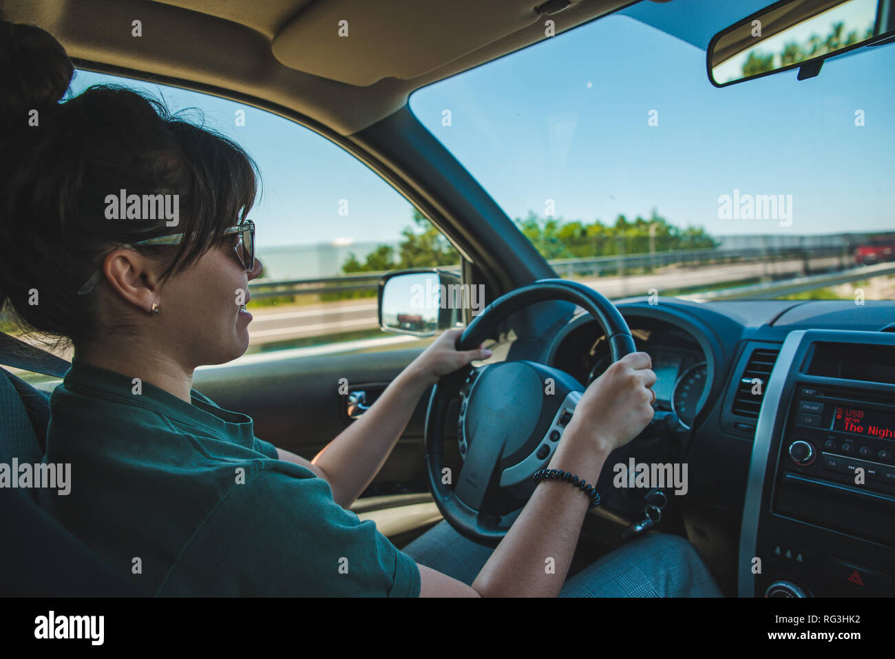 woman driving car by speedway. summer time Stock Photo - Alamy