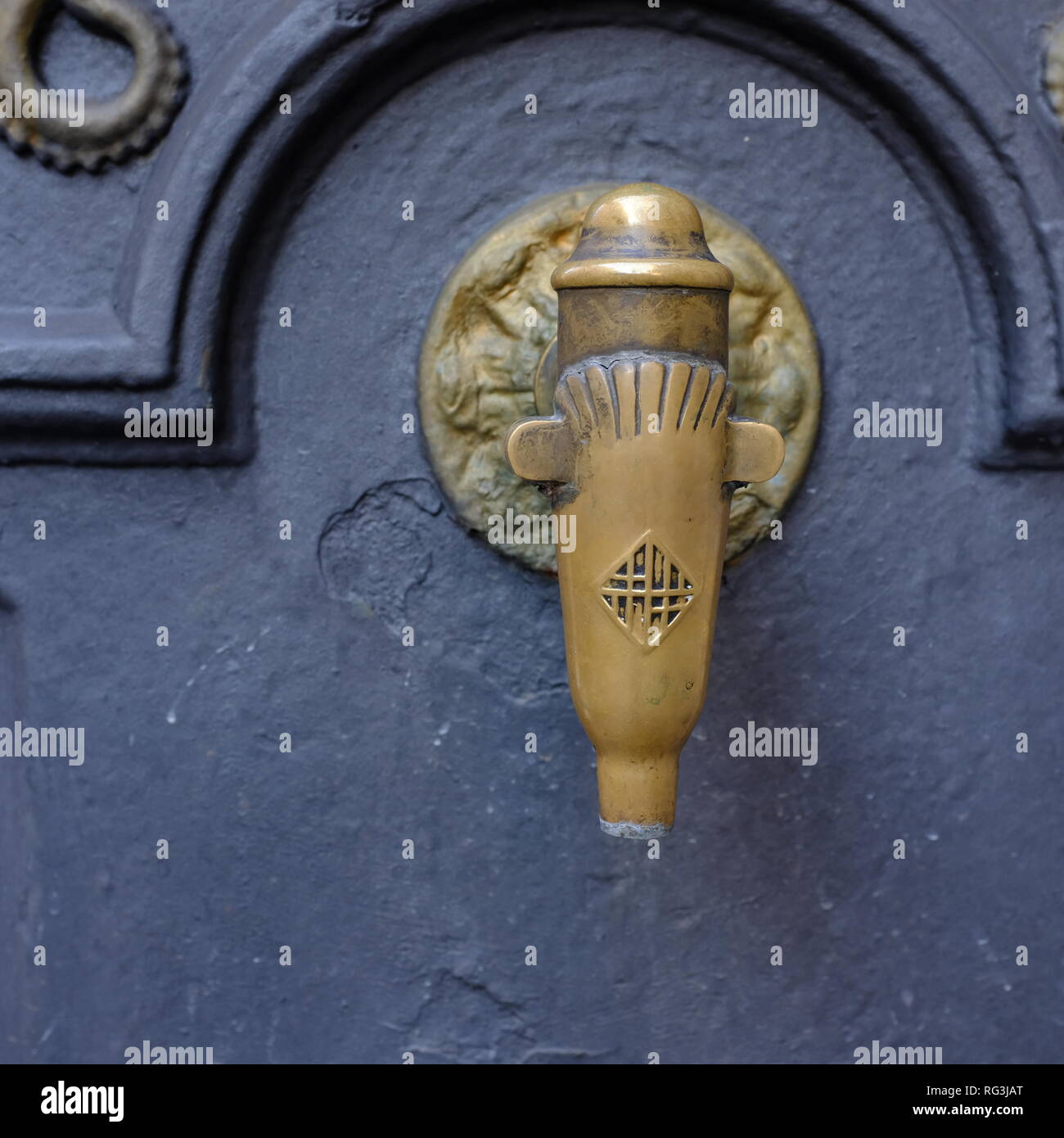 Bronze tap on slate water trough Barcelona Spain Stock Photo - Alamy