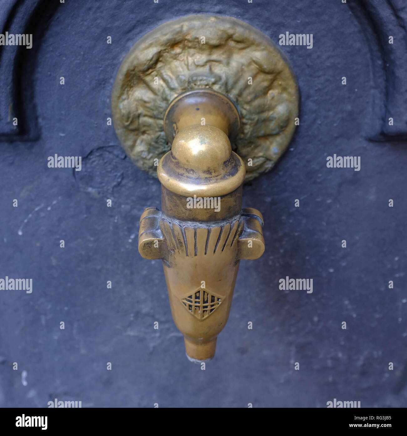 Bronze tap on slate water trough Barcelona Spain Stock Photo - Alamy
