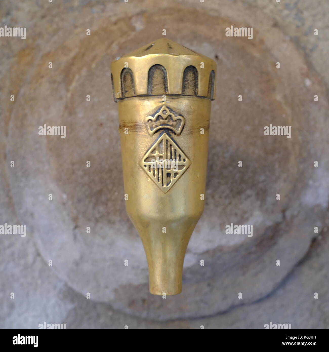 Bronze tap on slate water trough Barcelona Spain Stock Photo - Alamy