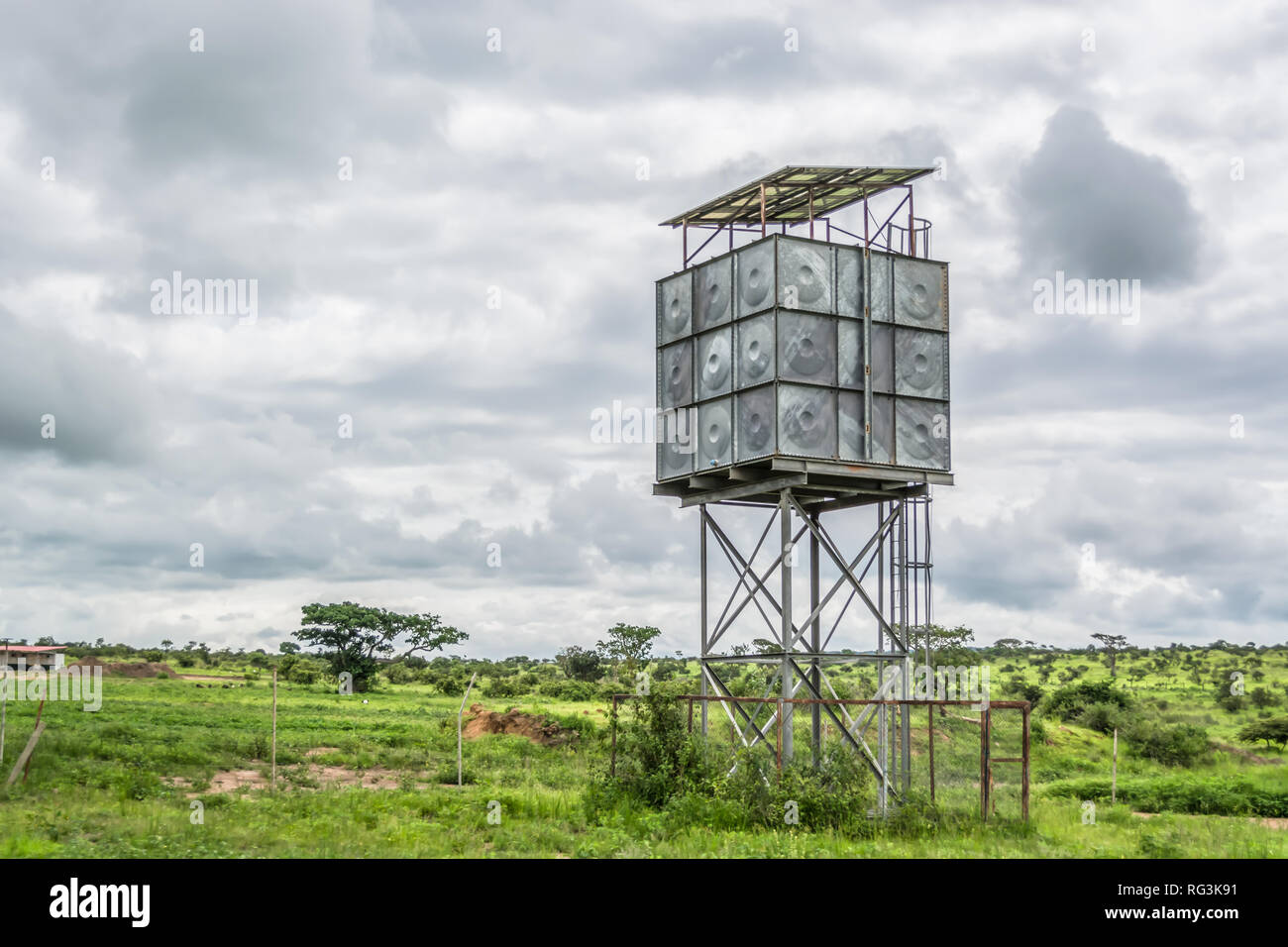 View with typical tropical landscape with a metal watchtower structure ...