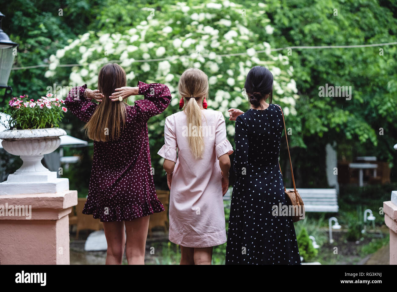 Three girls posing on camera Stock Photo - Alamy