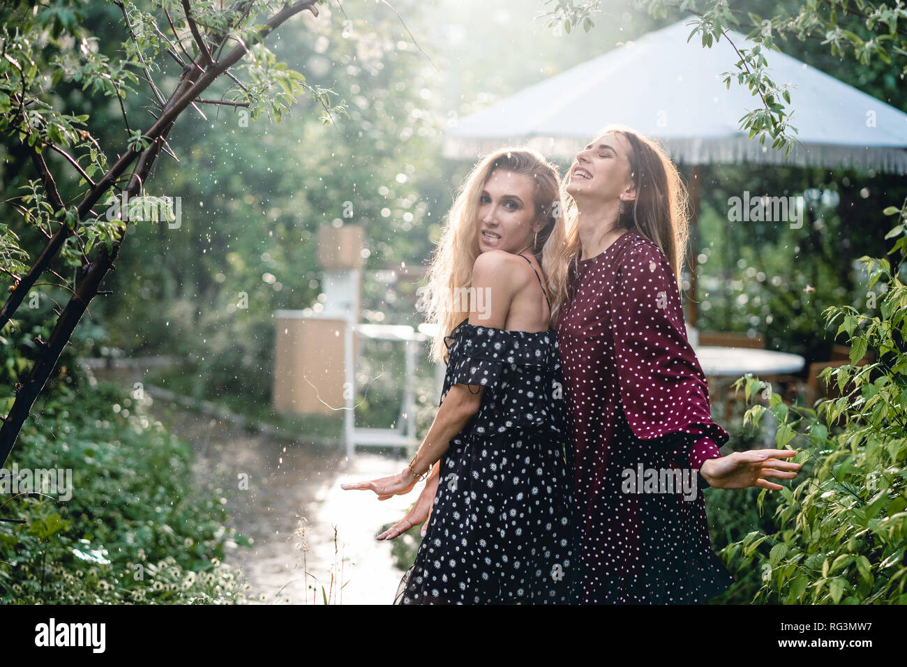 Two girls in a summer park Stock Photo - Alamy