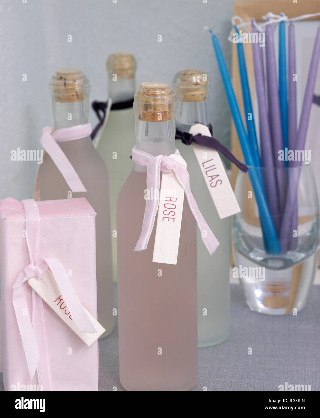 Home made flower scented water in glass bottles Stock Photo - Alamy