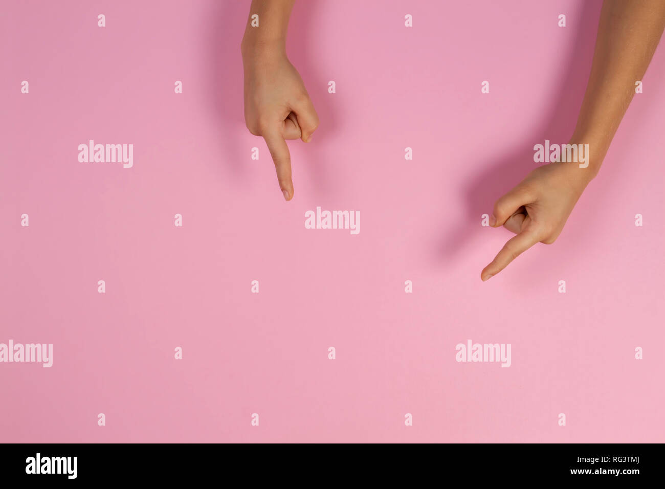 Children hands pointing on pastel pink background Stock Photo - Alamy