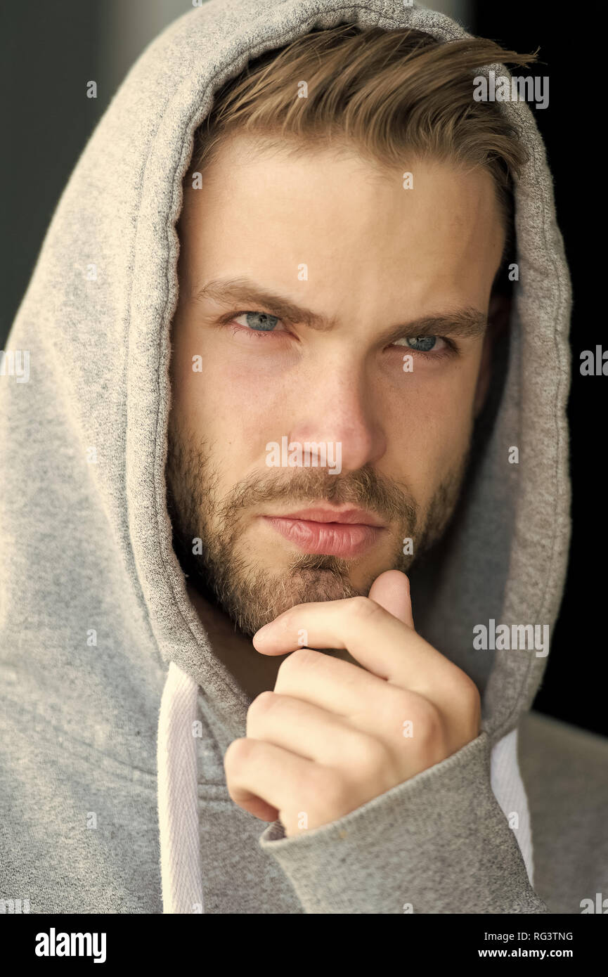 Guy bearded and attractive touches bristle on chin. Masculinity concept ...