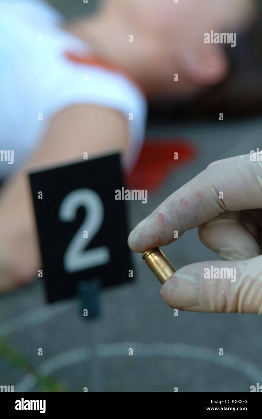 DEU, Germany, NRW: Forensic detectiv search a crime scene. The officers ...