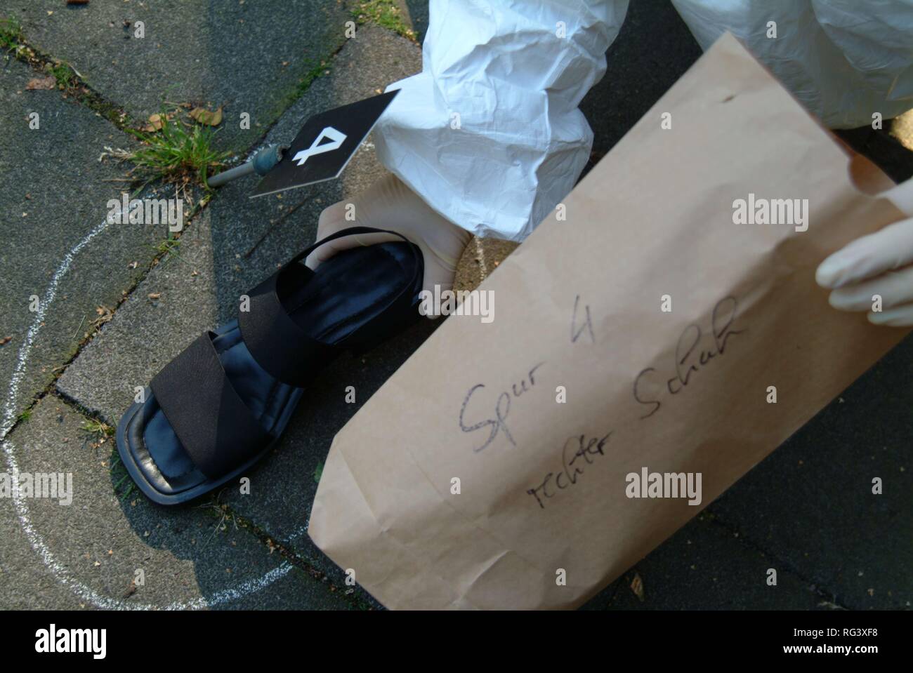 DEU, Germany, NRW: Forensic detectiv search a crime scene. The officers ...