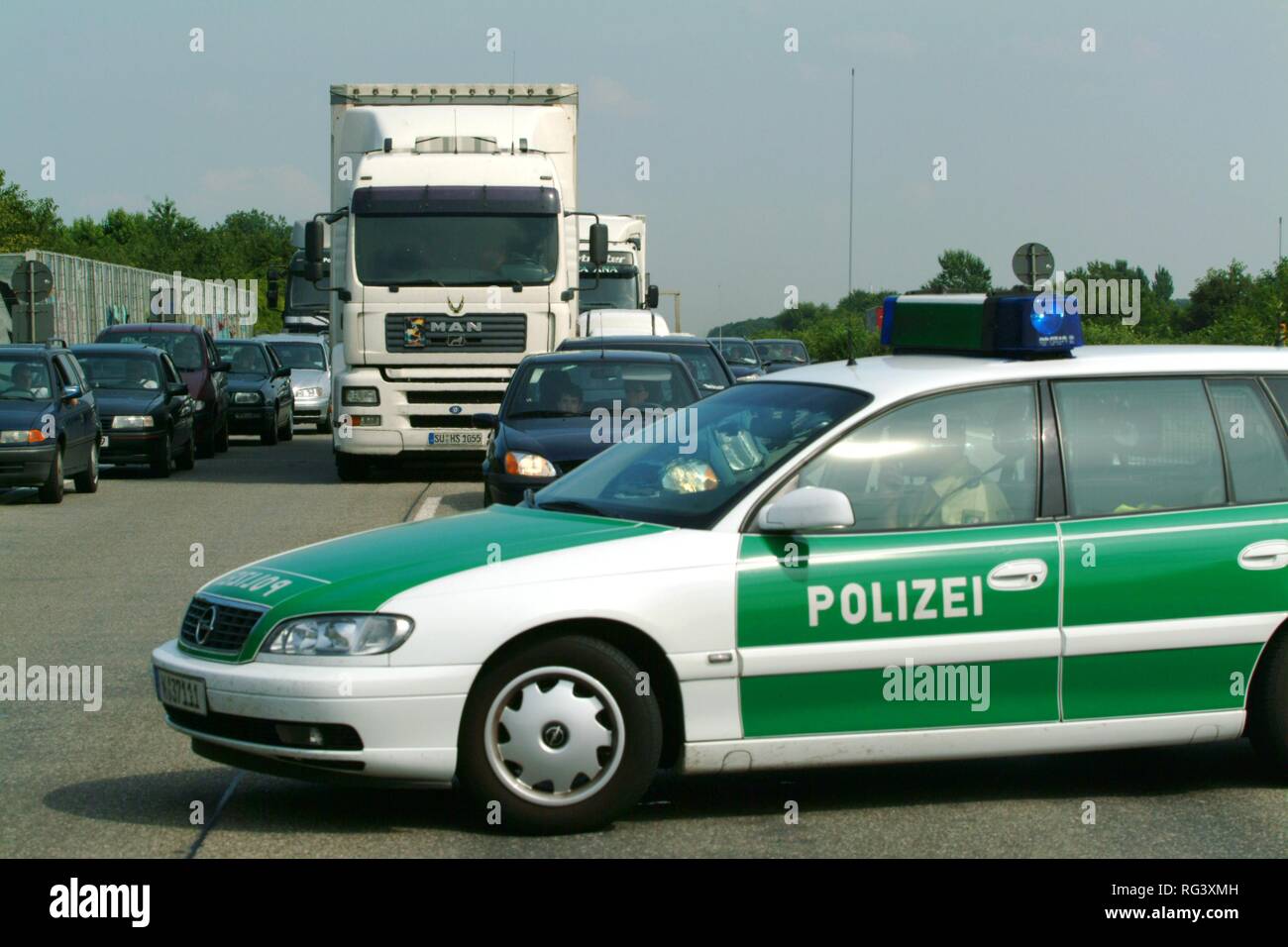 Police patrol car blocks a lane hi-res stock photography and images - Alamy