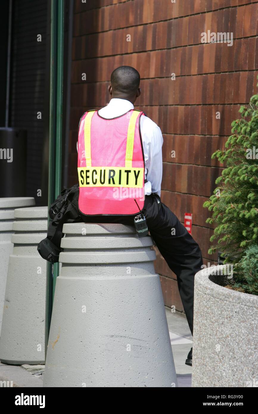 USA, United States of America, New York City: Security guard on a break ...