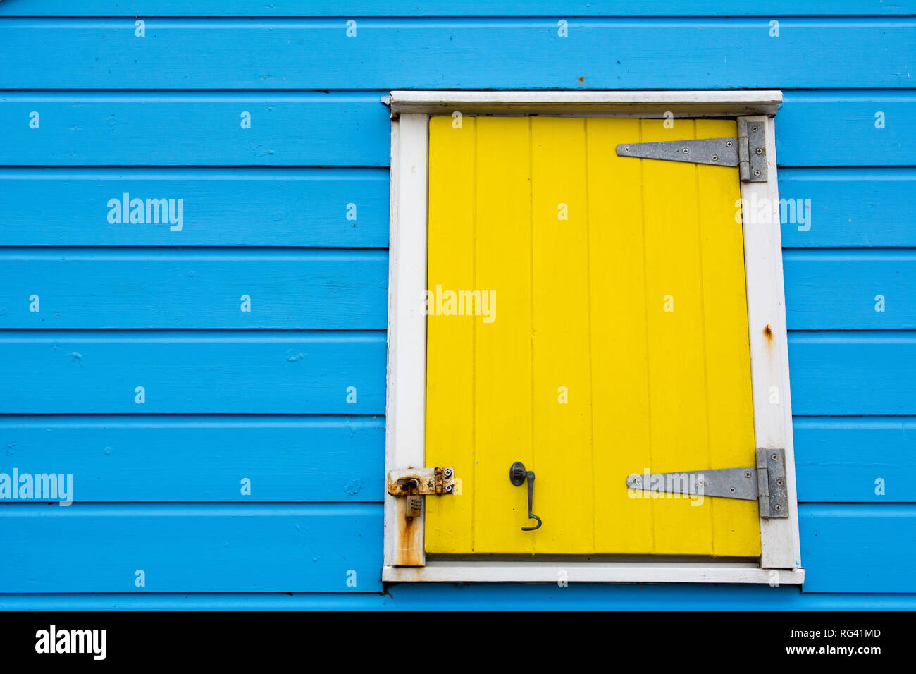 Colourfull window hatch on side of wooden beach hut Stock Photo - Alamy