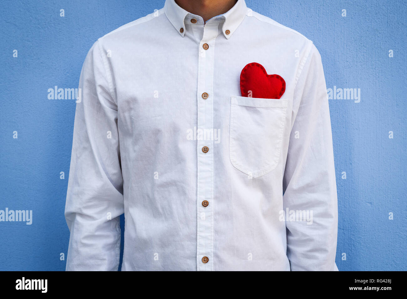 The guy in the white shirt with a red valentine in his pocket against ...