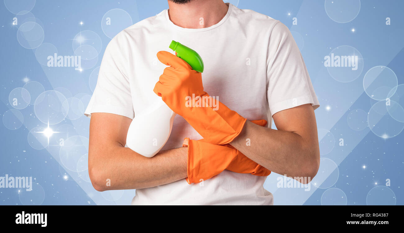 Glittered blue background with male housekeeper and cleaning equipment ...