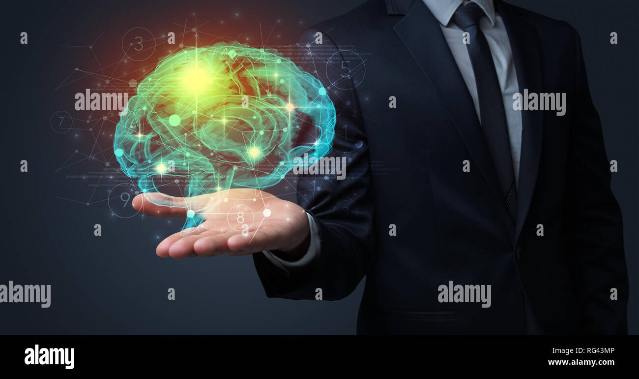 Businessman holding human brain on his hand with logistics symbols ...