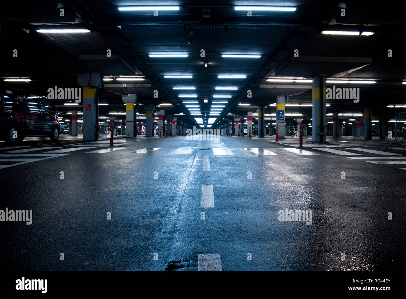 Neon lighted night garage parking Stock Photo - Alamy