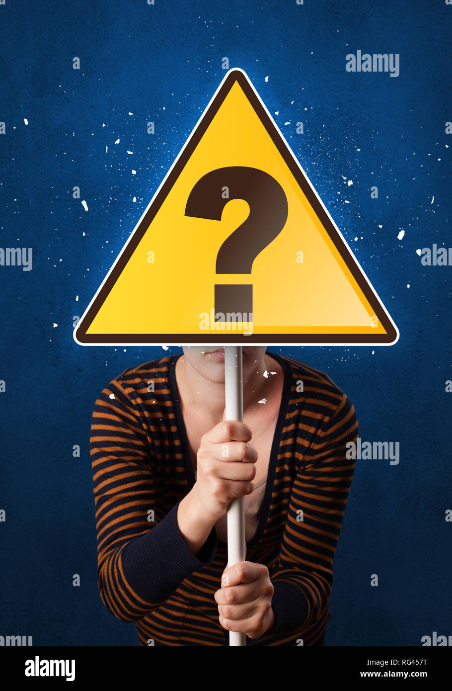 Casual young woman holding yellow sign with question mark Stock Photo ...