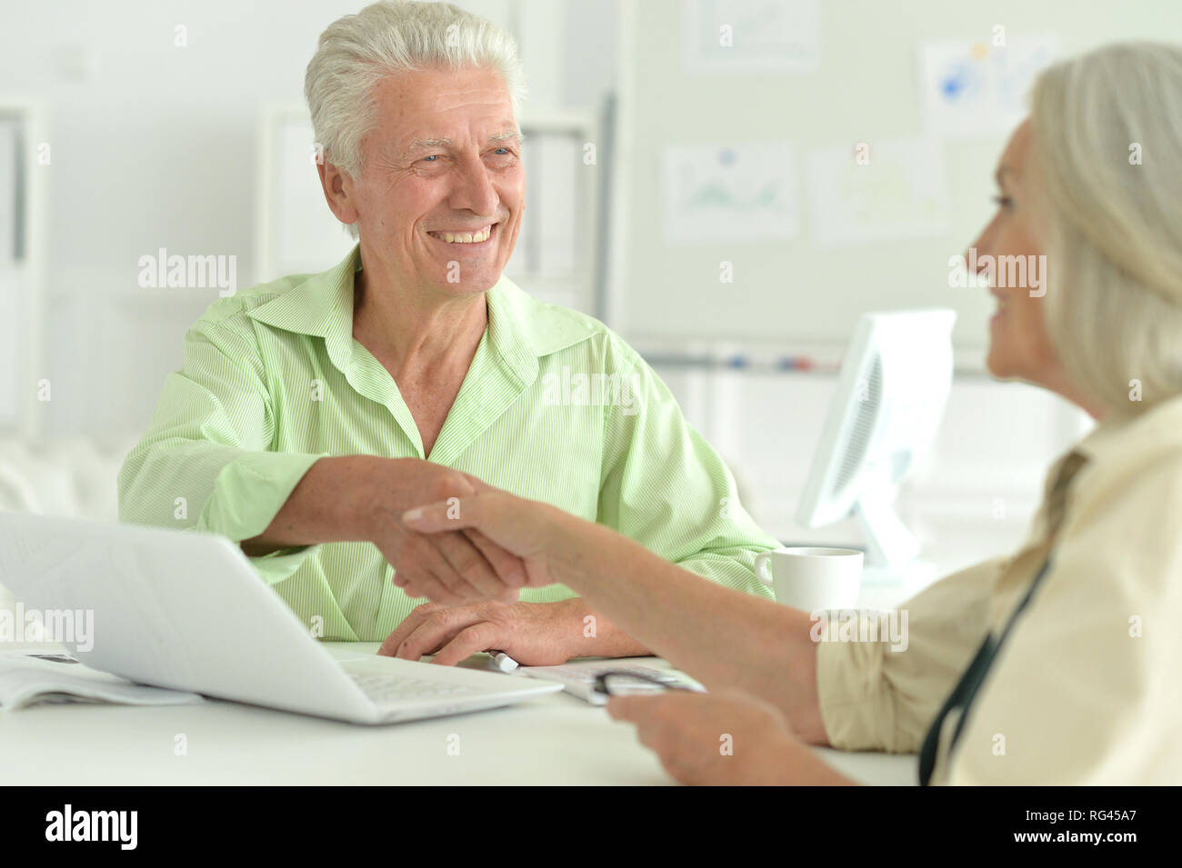 Portrait of senior business people working in the office Stock Photo ...