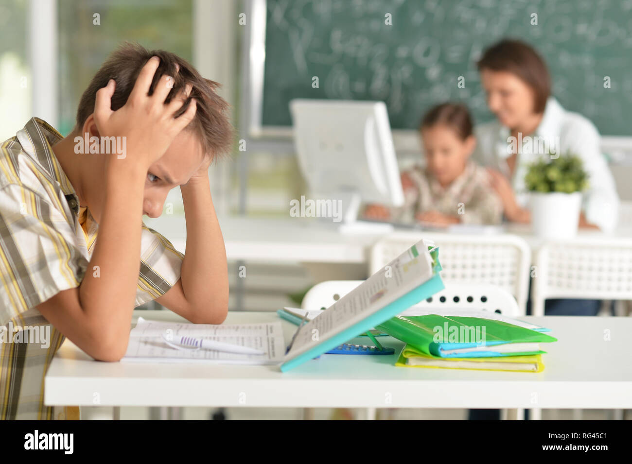 Portrait of children at school in the classroom Stock Photo - Alamy