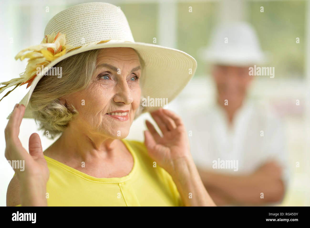 Beautiful senior woman in yellow hi-res stock photography and images ...