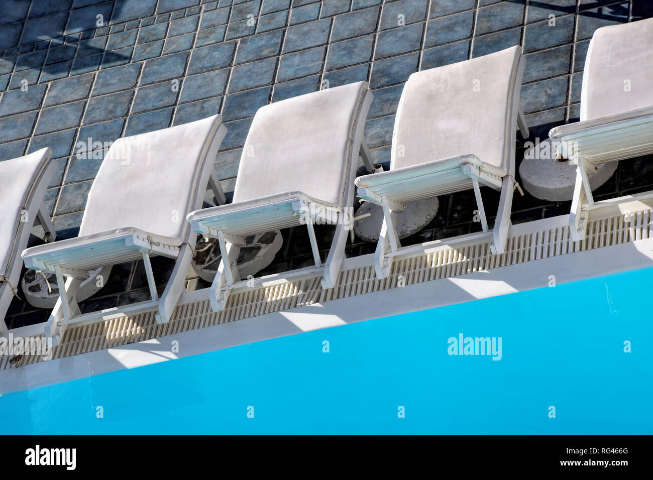 Sunbeds with swimming pool Stock Photo - Alamy