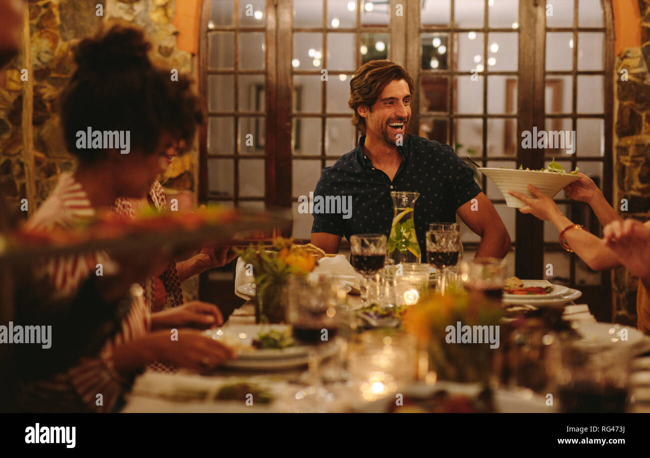 People laughing at dinner table hi-res stock photography and images - Alamy