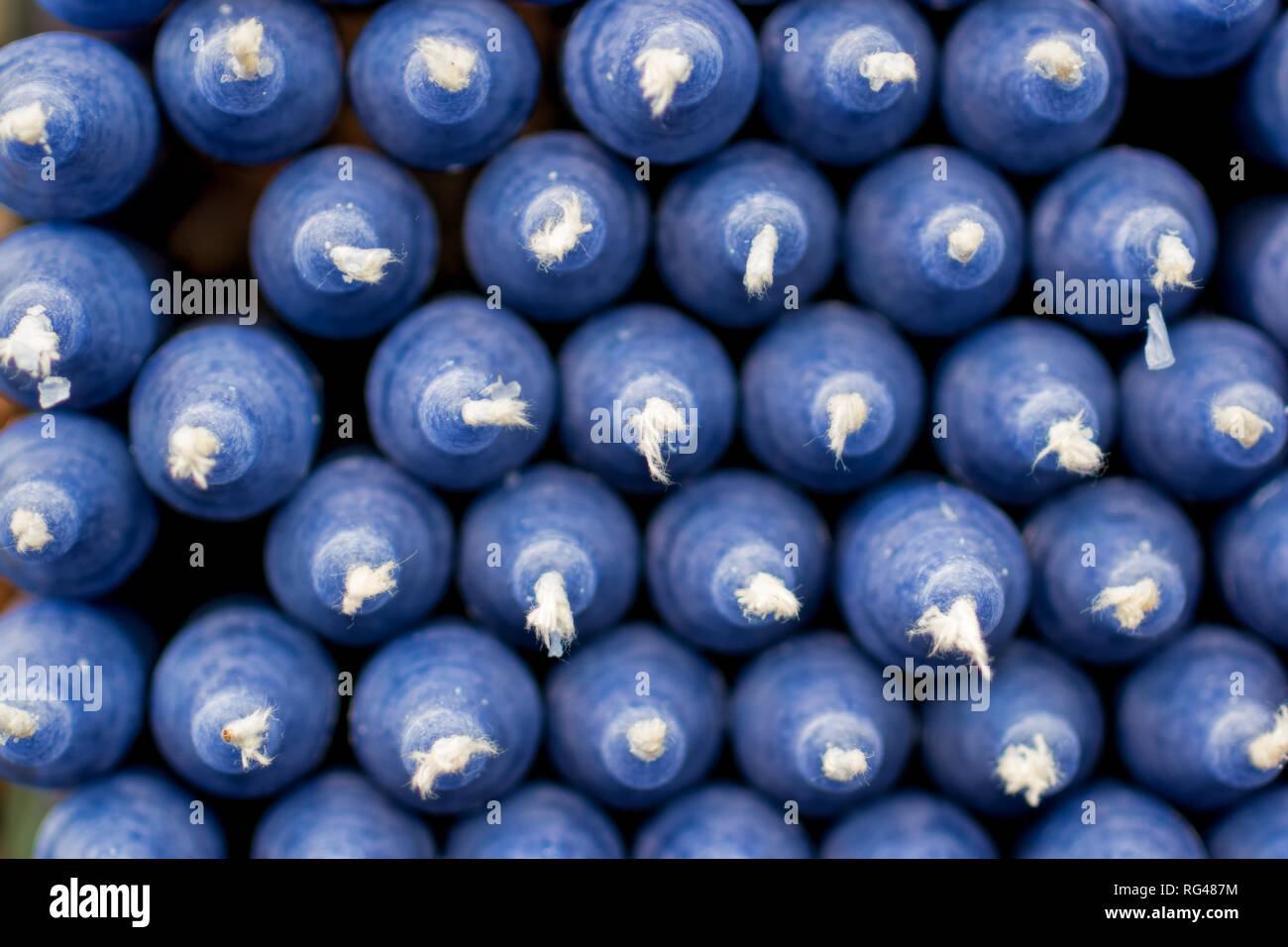 stack of brightly colored blue candles Stock Photo - Alamy
