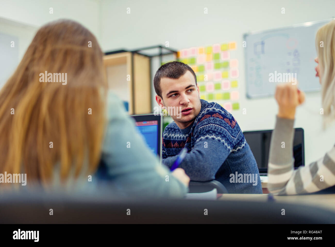 Young students are in classroom, they are looking interested Stock ...