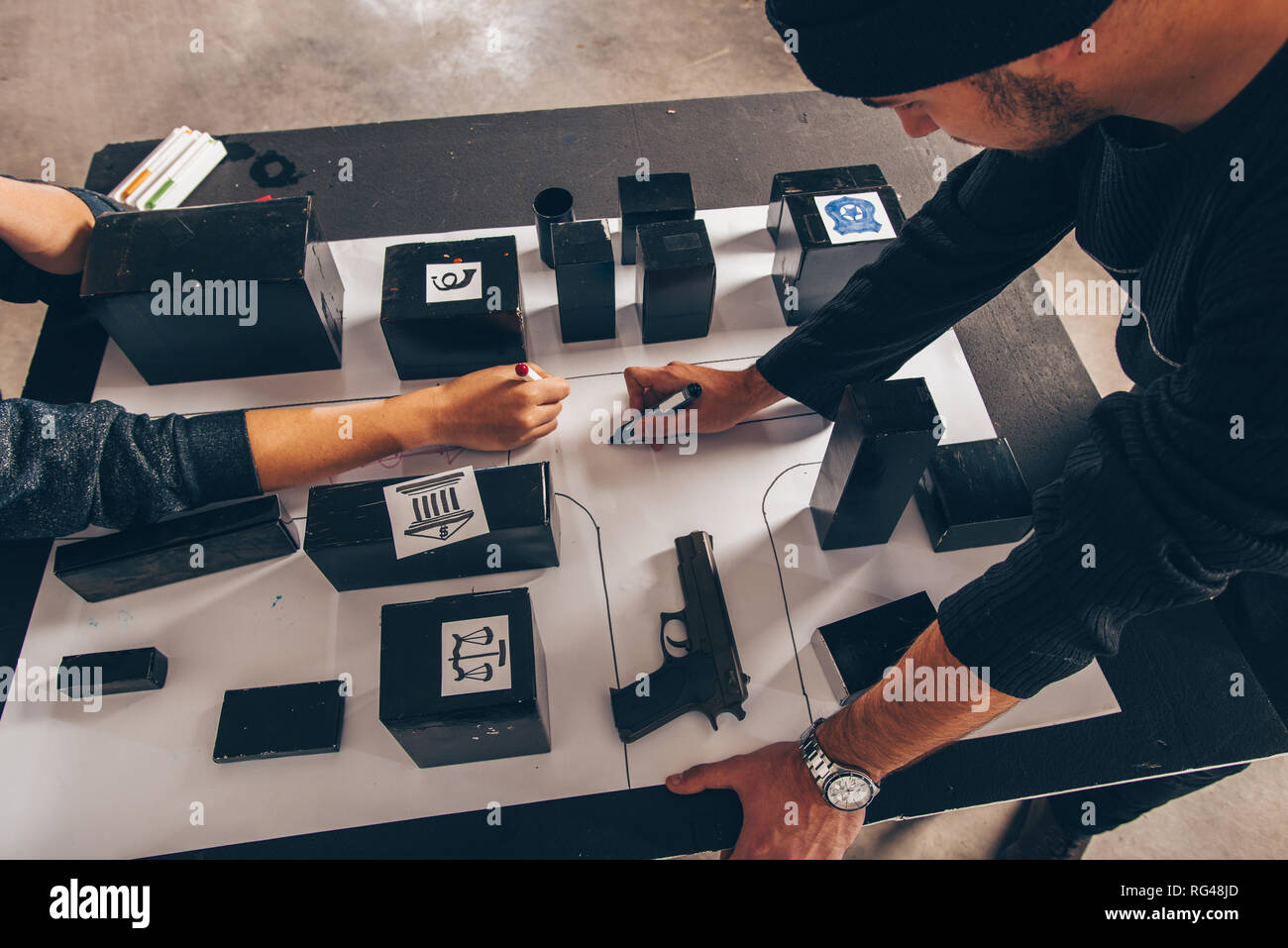 Male persons are sitting in a room with maps and they are preparing for ...