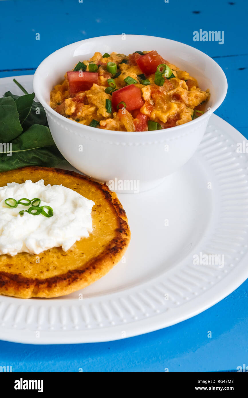 Traditional colombian breakfast huevos pericos with corn cakes Stock ...