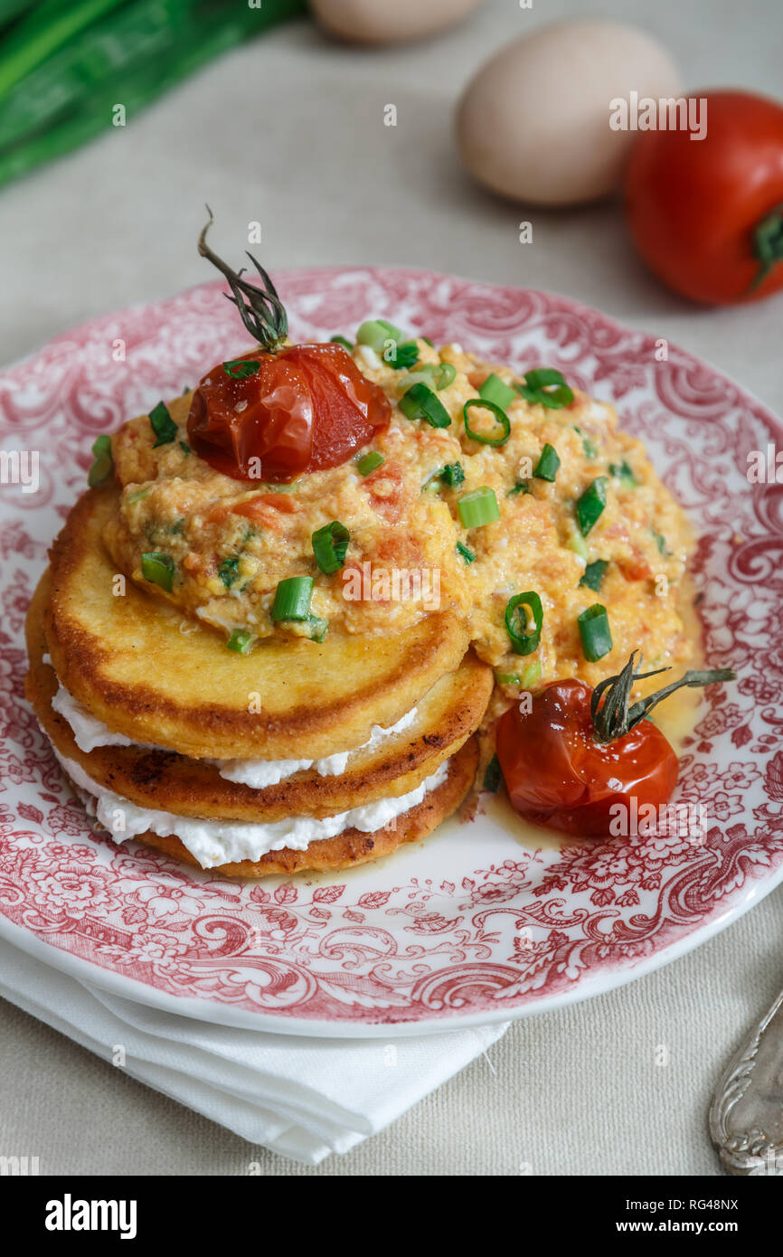 Traditional colombian breakfast huevos pericos with corn cakes Stock ...