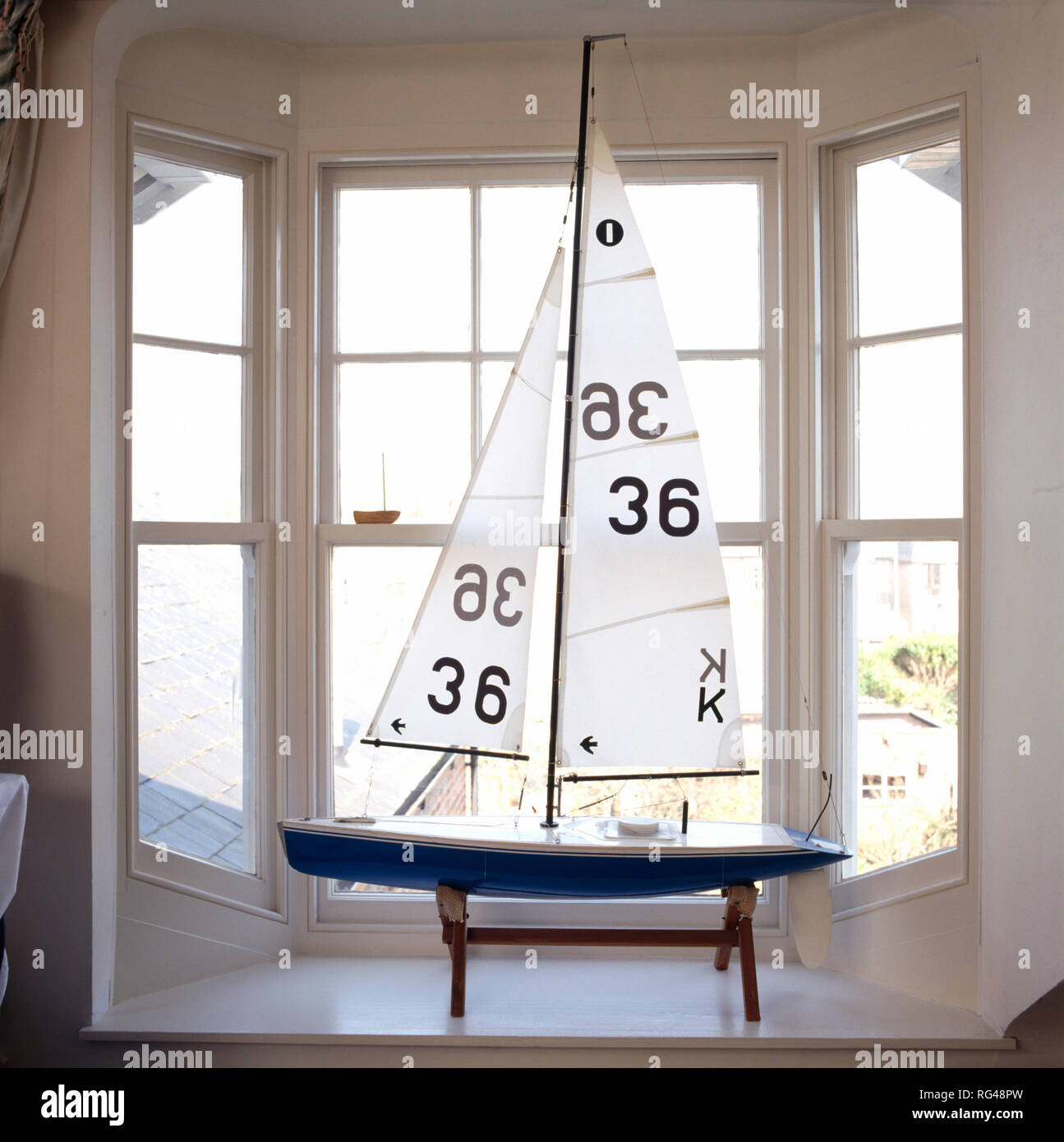 Numbered sails on model yacht Stock Photo - Alamy