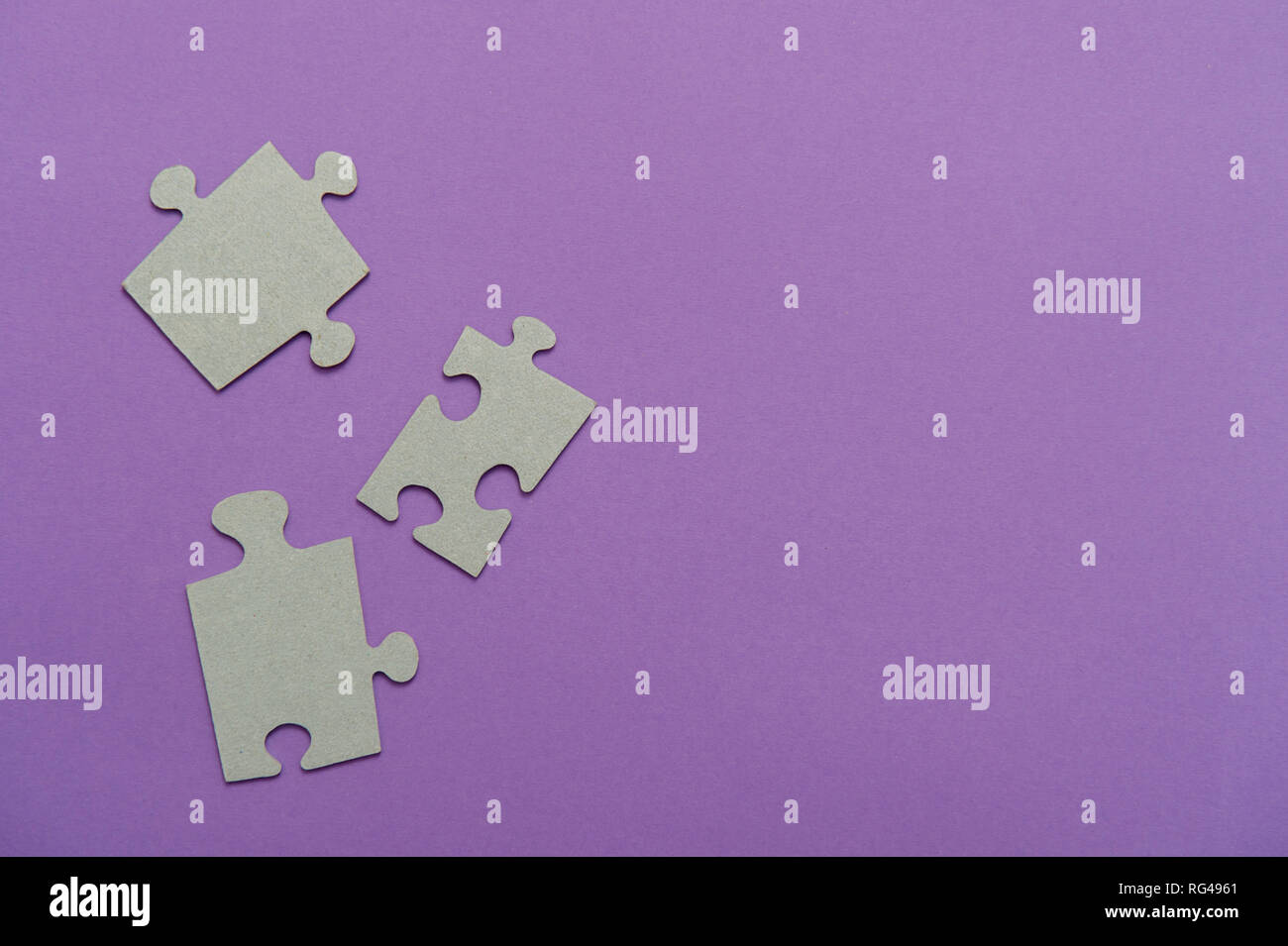 Puzzles on a purple background as a symbol of autism. Conceptual vision ...