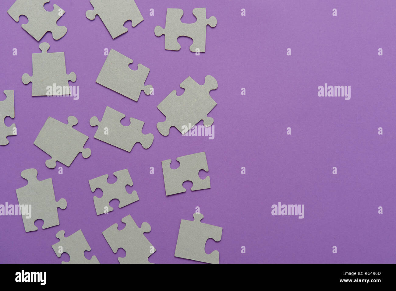 Puzzles on a purple background as a symbol of autism. Conceptual vision ...