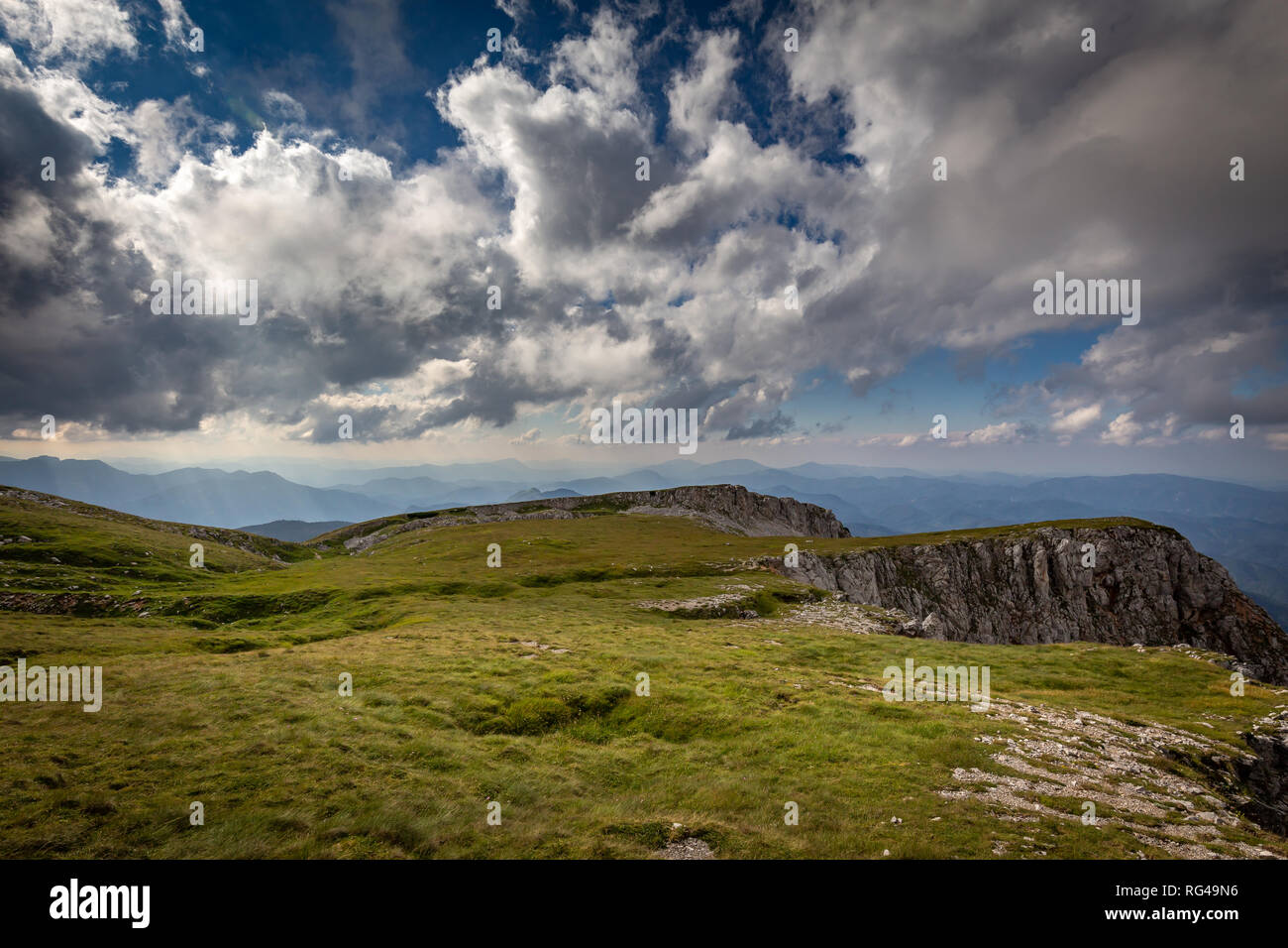 View from the edge of Rax plateau, with green, grassy meadow and blue ...