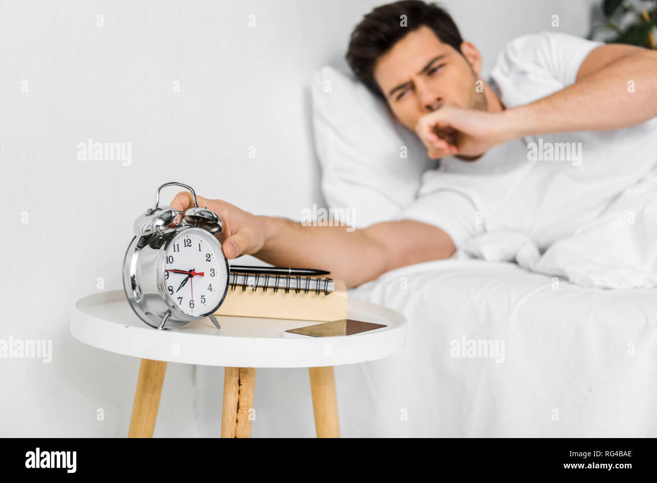 Waking up and looking at an alarm clock hi-res stock photography and ...