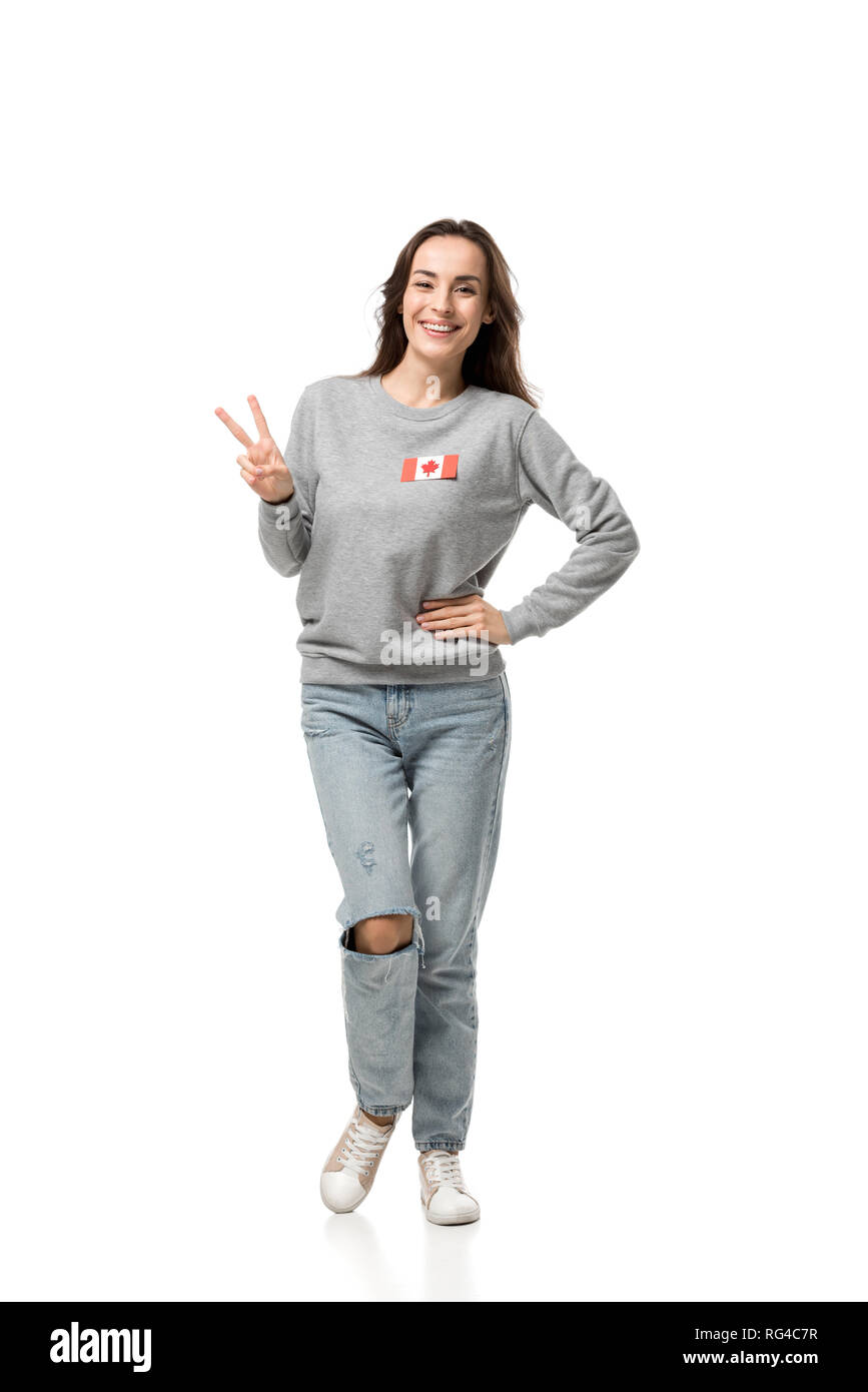 happy woman with canadian flag badge showing peace sign isolated on ...