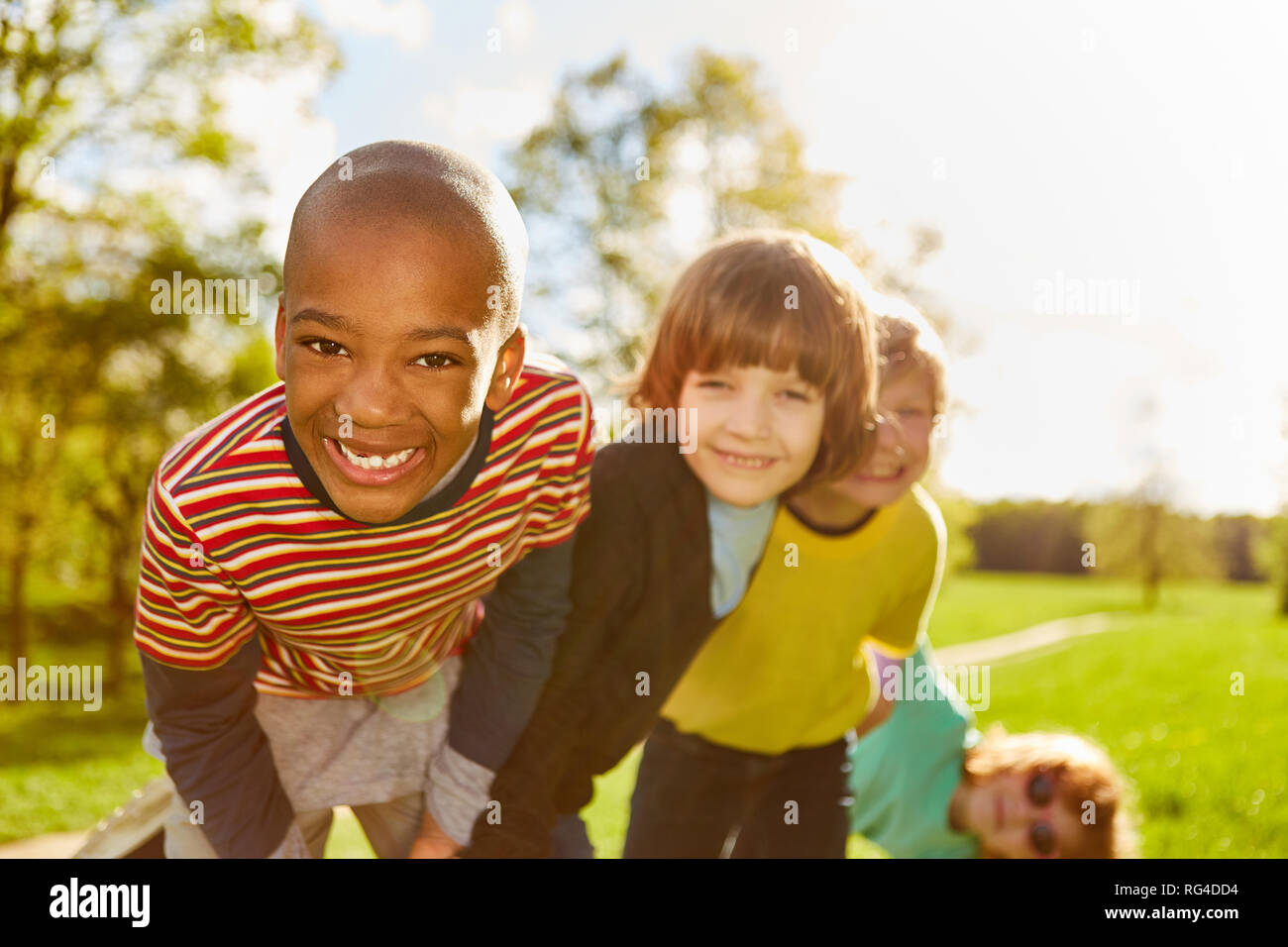 Happy African boy and his friends in multicultural kindergarten Stock ...