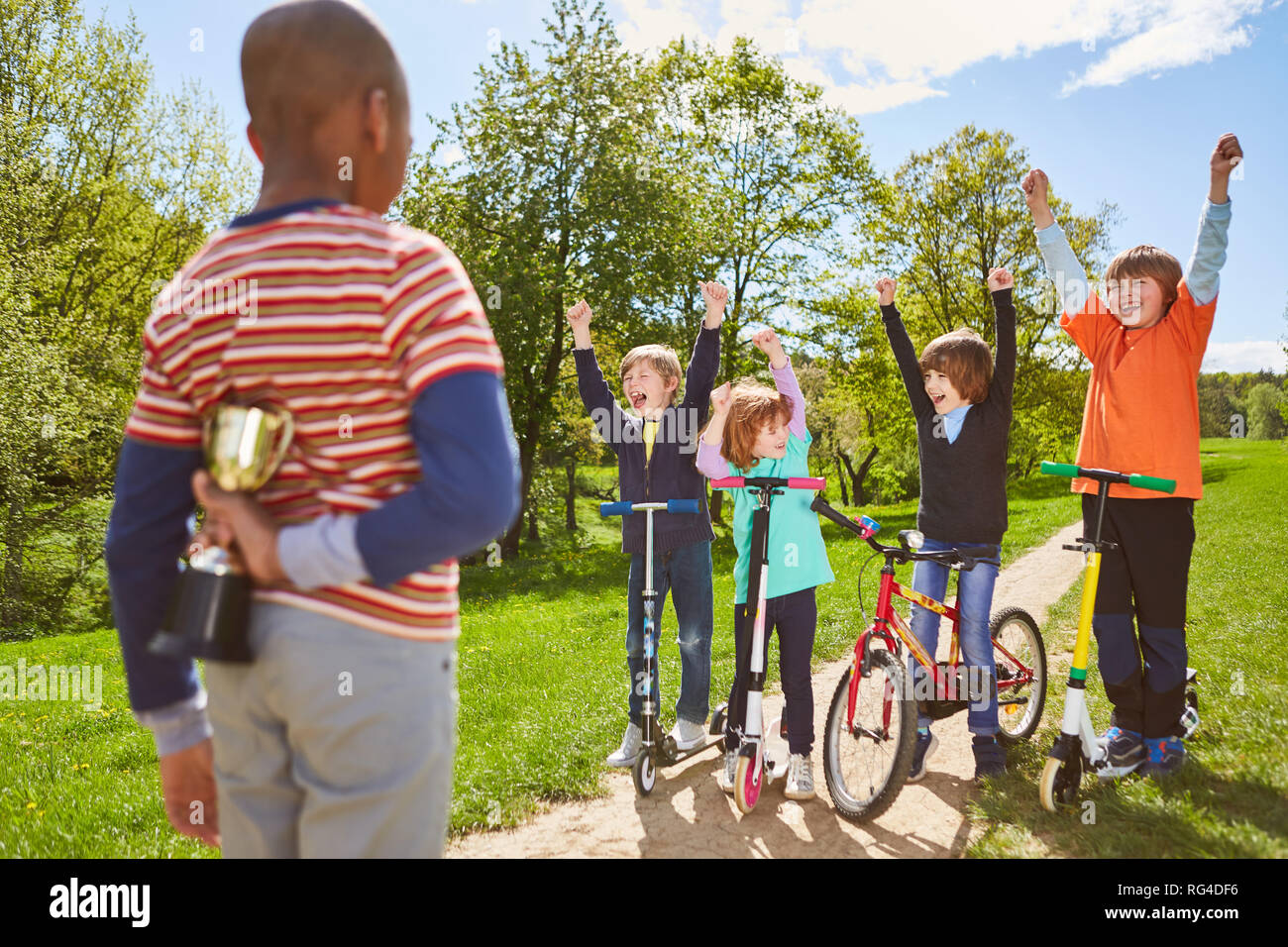 Children cheer as winners after a race and look forward to the cup ...