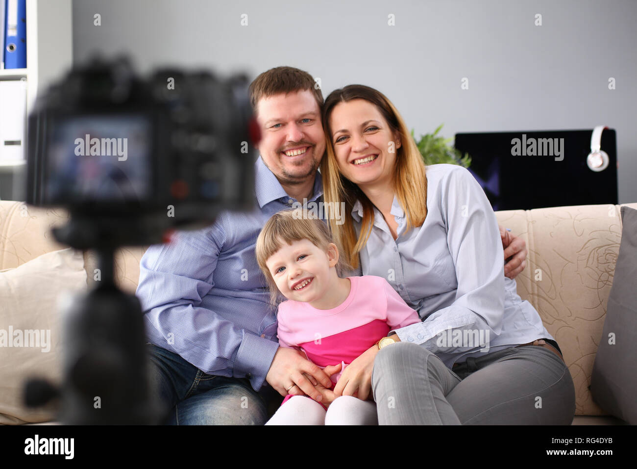 Happy adult millenial family photographed Stock Photo - Alamy