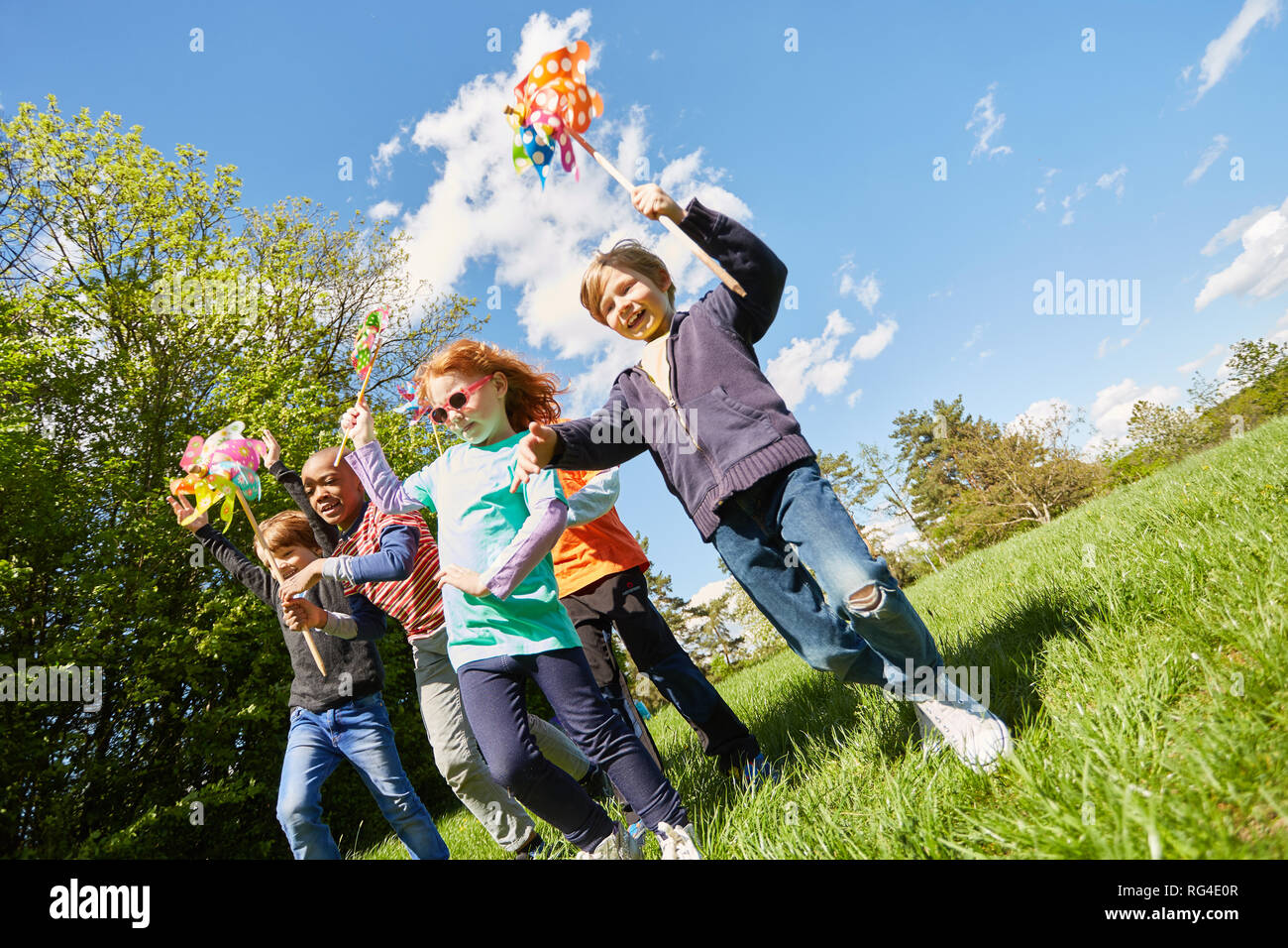 Children have fun at summer camp and run in the sunshine with wind ...
