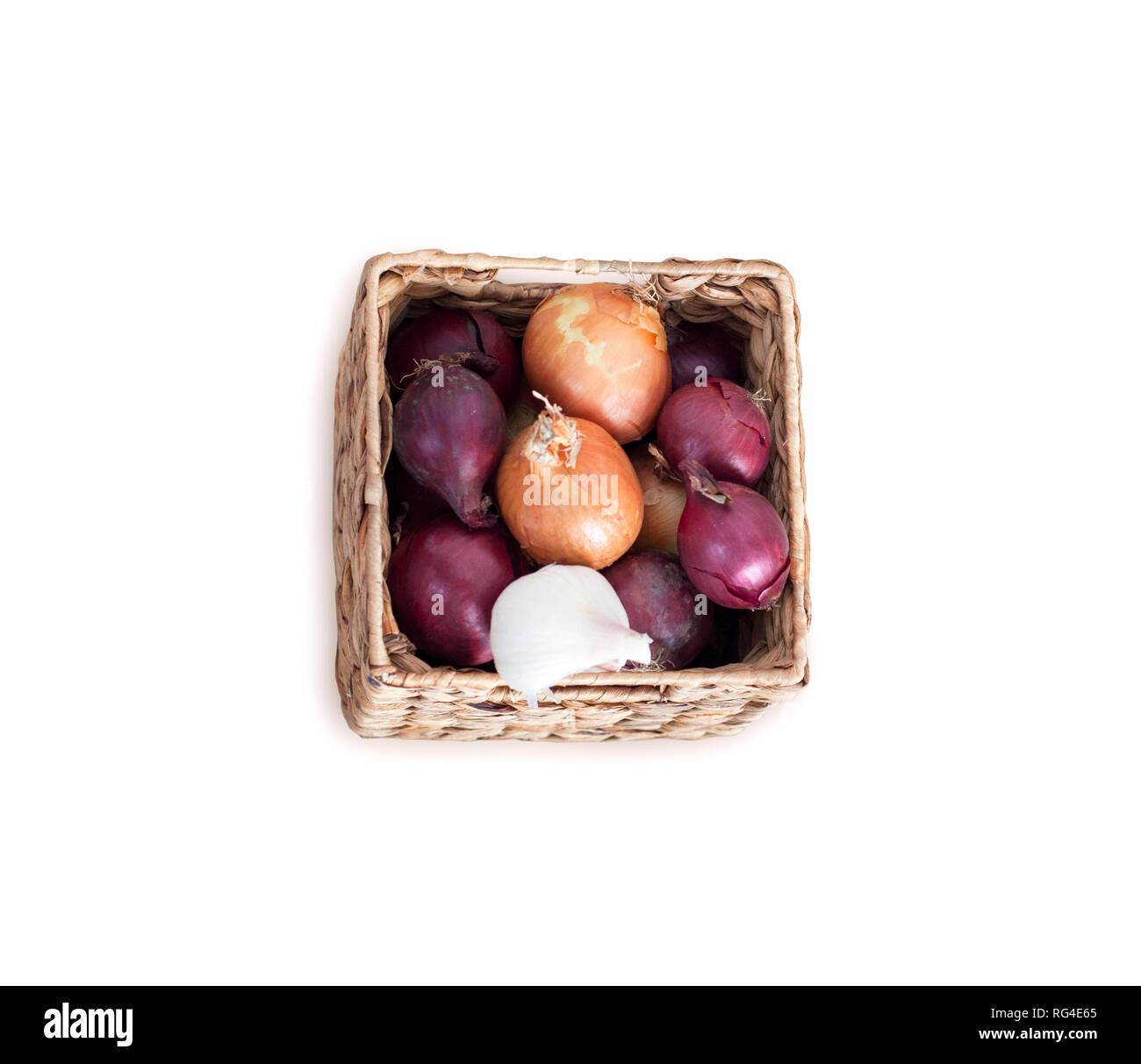 Purple and white onions in squar, wicker box isolated on white ...