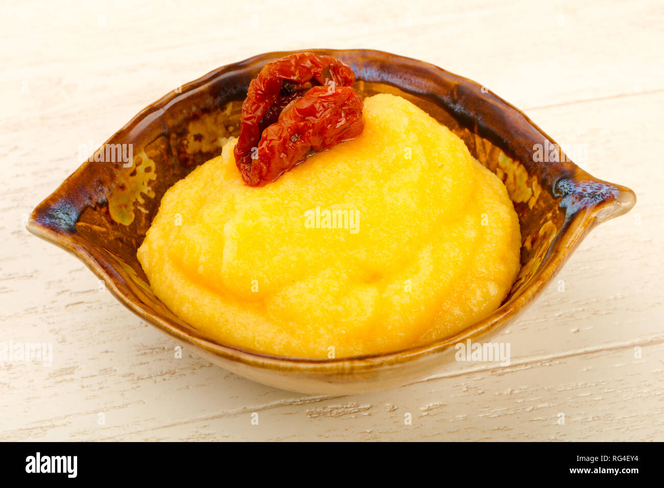 Polenta with dry tomato Stock Photo - Alamy