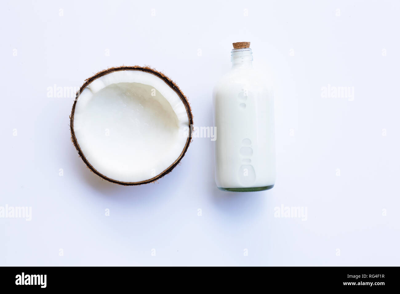 Coconut with coconut milk on white background Stock Photo - Alamy
