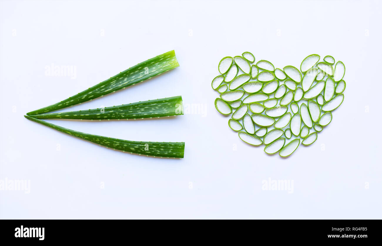 Aloe vera slices heart shape and aloe vera leaves on white background ...
