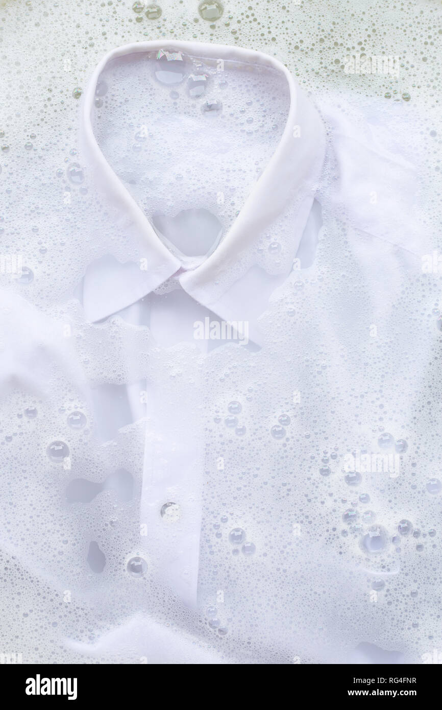 Soak a cloth before washing, white shirt Stock Photo - Alamy