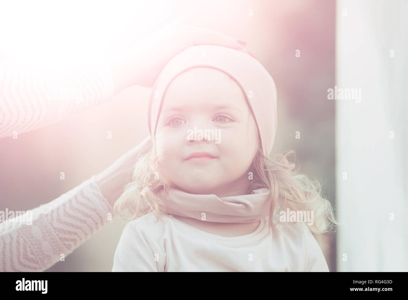 Put on hat child hi-res stock photography and images - Alamy