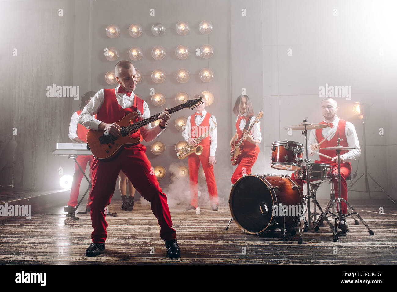 funny guitarist checking the instrument before the consert Stock Photo ...