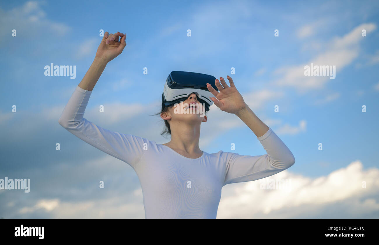 It seems so real. Cute girl play in simulated environment. Young woman ...